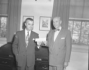 Dr. Messick and Leo Jenkins accept check (1 Negative (October 19, 1954 ...